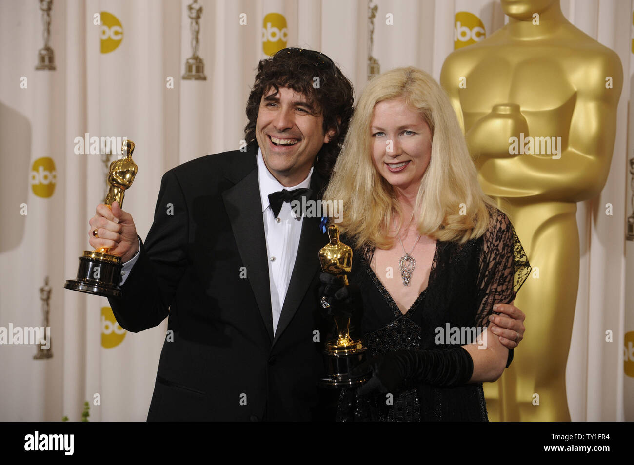 Bob Murawski and Chris Innis hold the Oscars for Achievement in Film ...