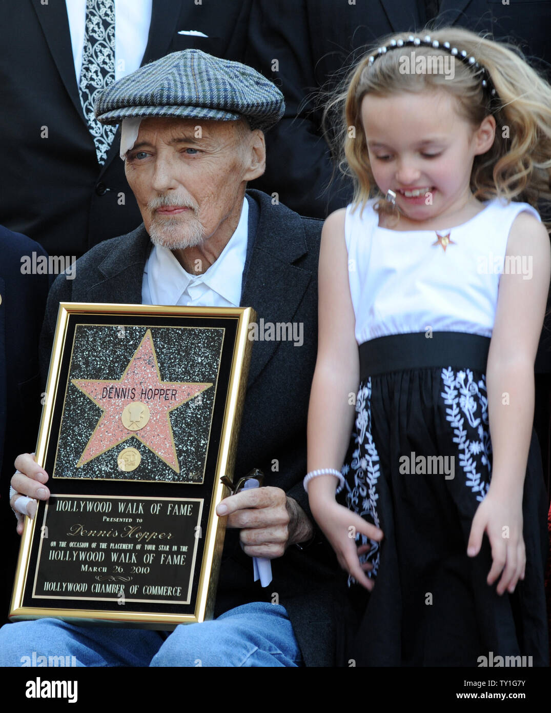 Actor Dennis Hopper looks on as his daughter Galen reacts during a ...