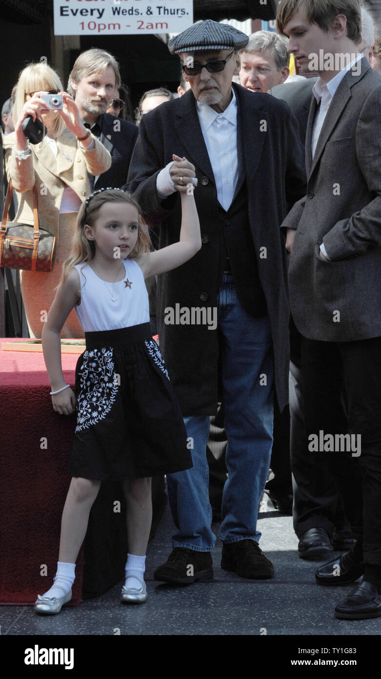 Actor Dennis Hopper walks with his daughter Galen during a ceremony ...