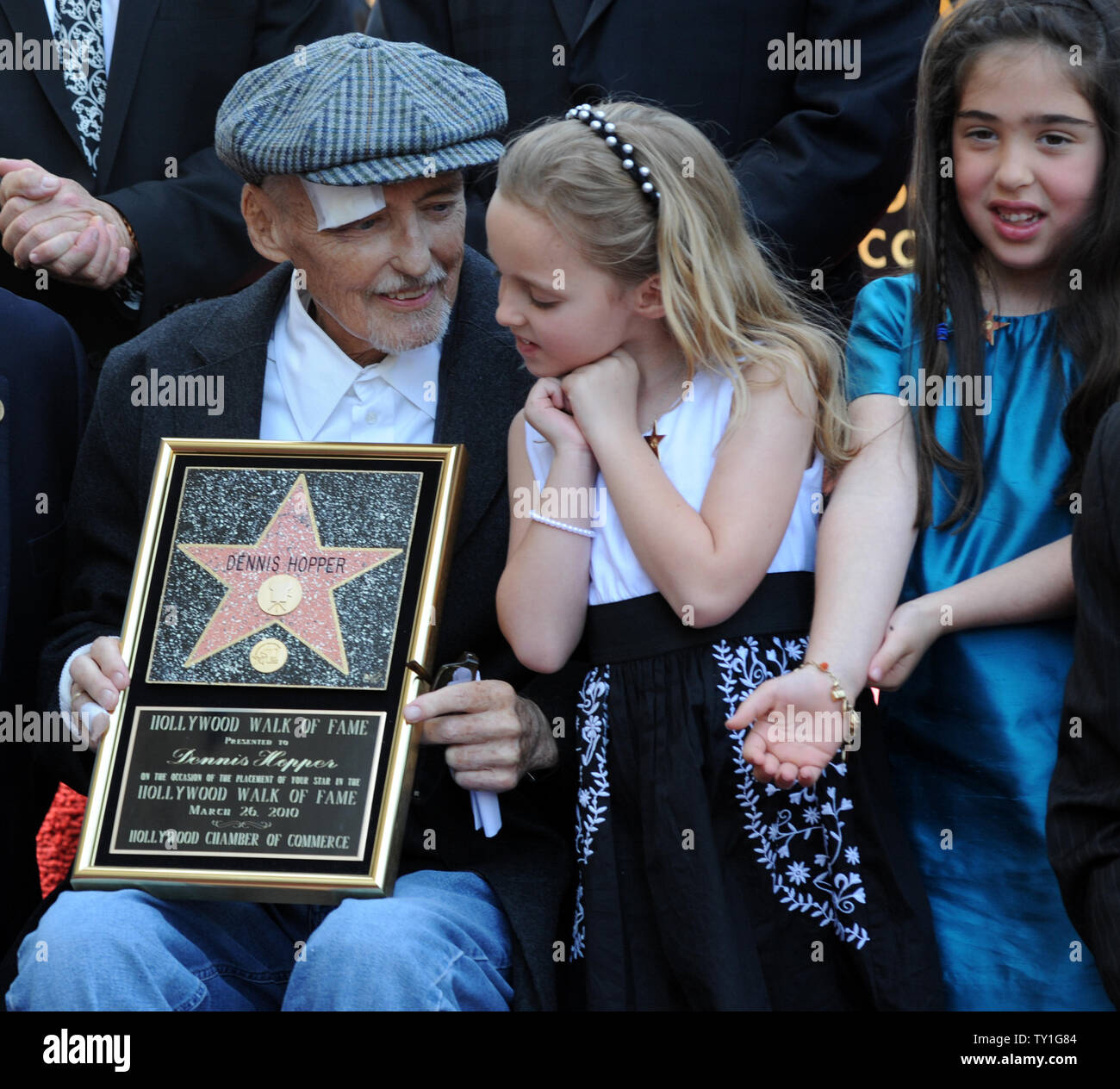 Actor Dennis Hopper looks on as his daughter Galen reacts during a ...