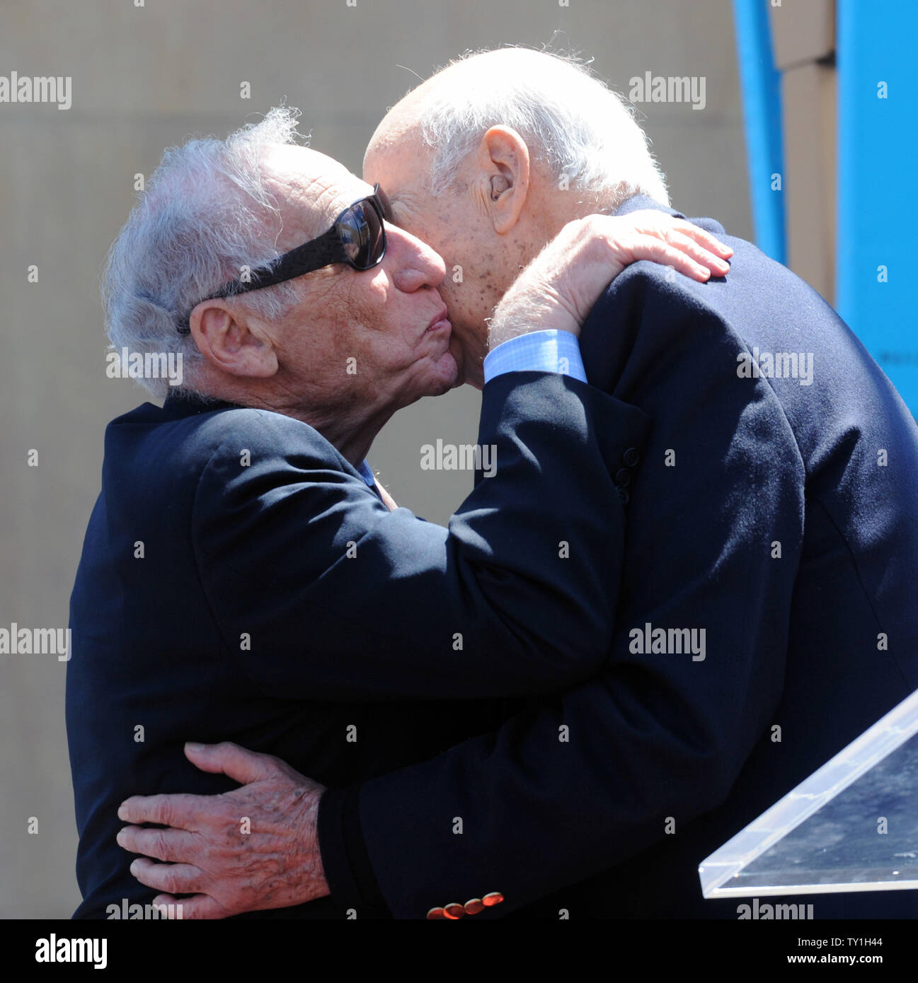 Mel Brooks (L) is embraced by his friend and associate, actor and ...