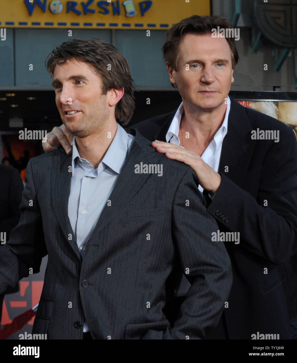 Sharlto Copley (L) and Liam Neeson, cast members in the motion picture ...