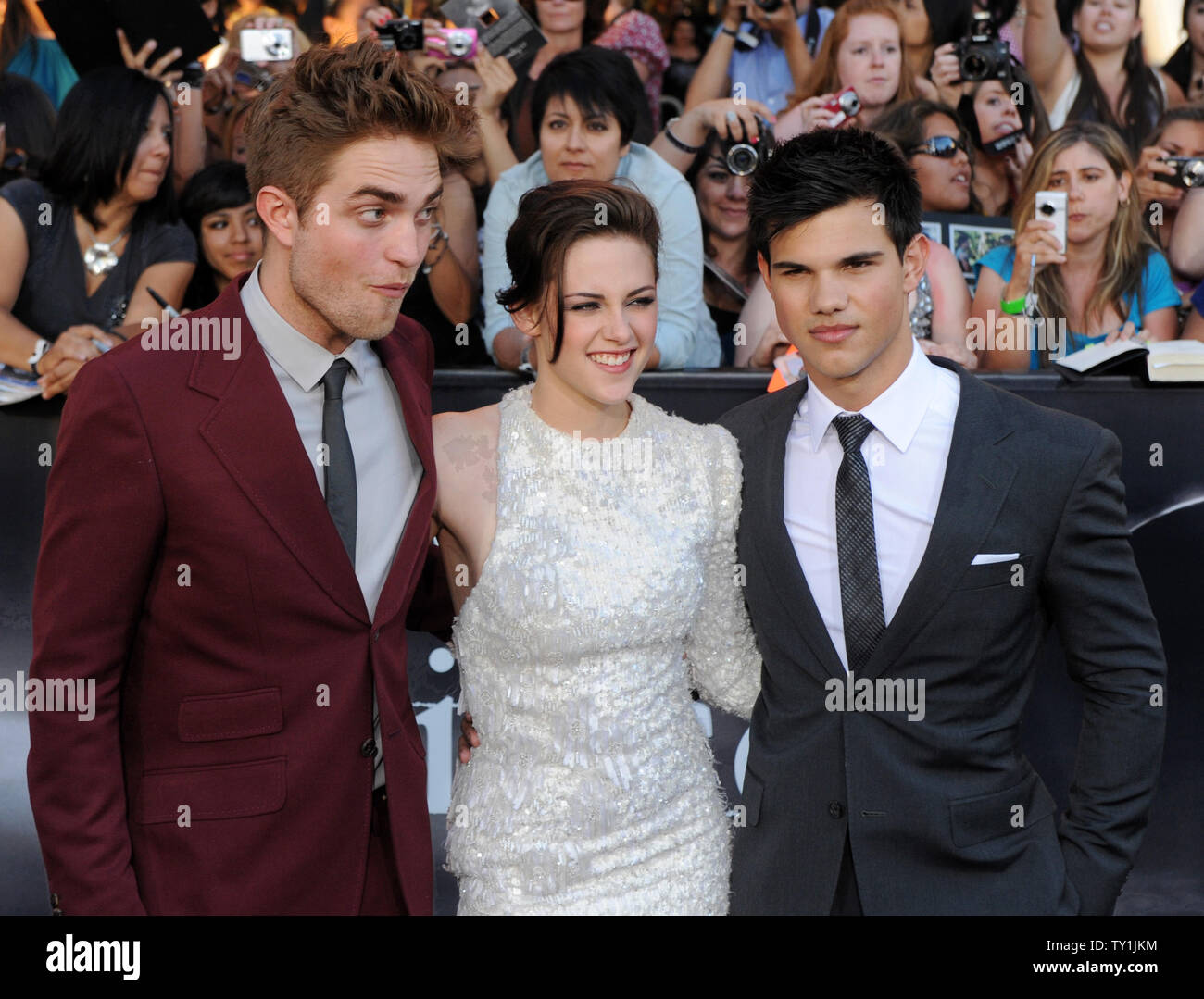 Cast members Robert Pattinson, Kristen Stewart and Taylor Lautner (L-R ...