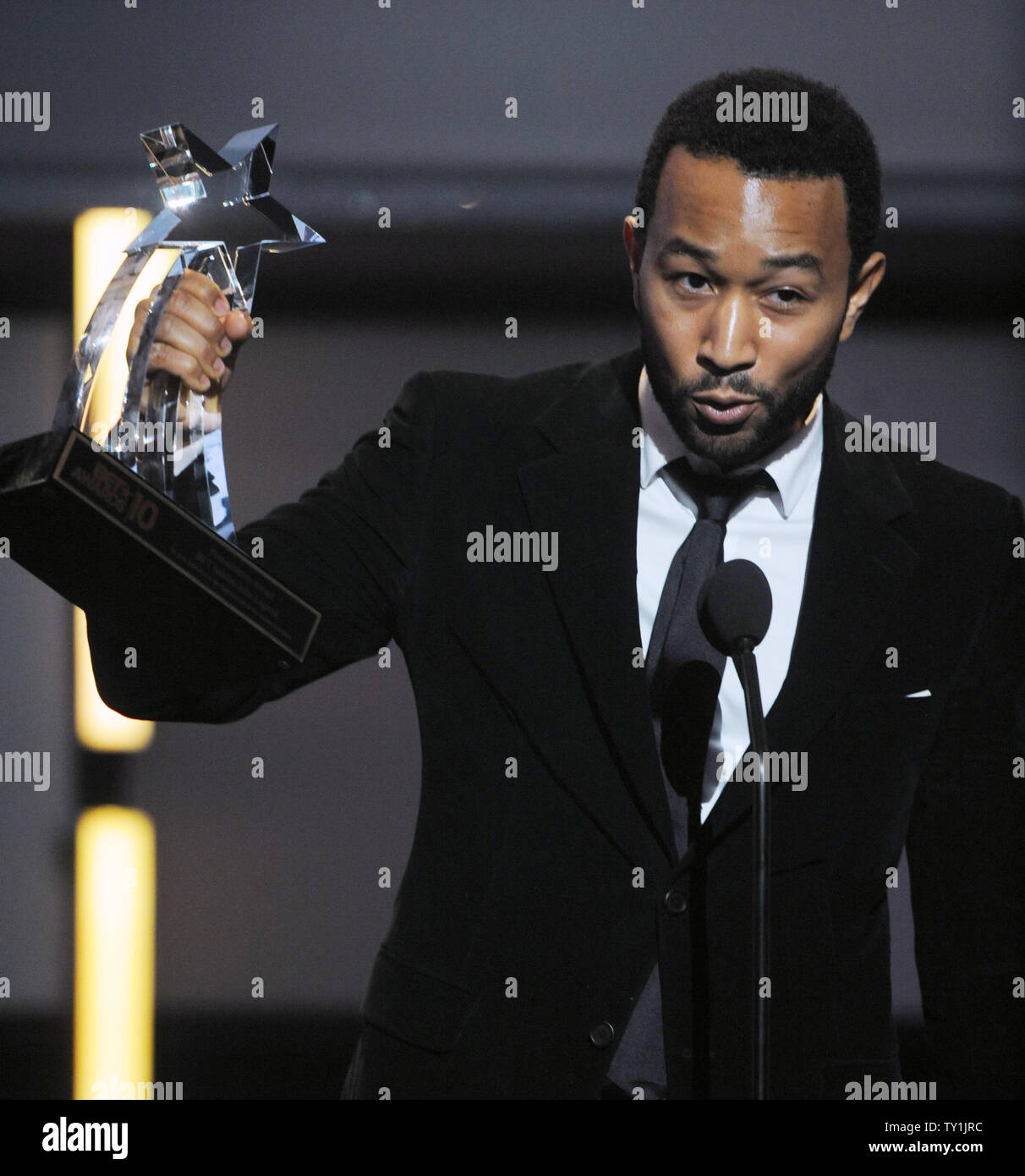 Singer John Legend accepts the Humanitarian Award at the 2010 BET ...