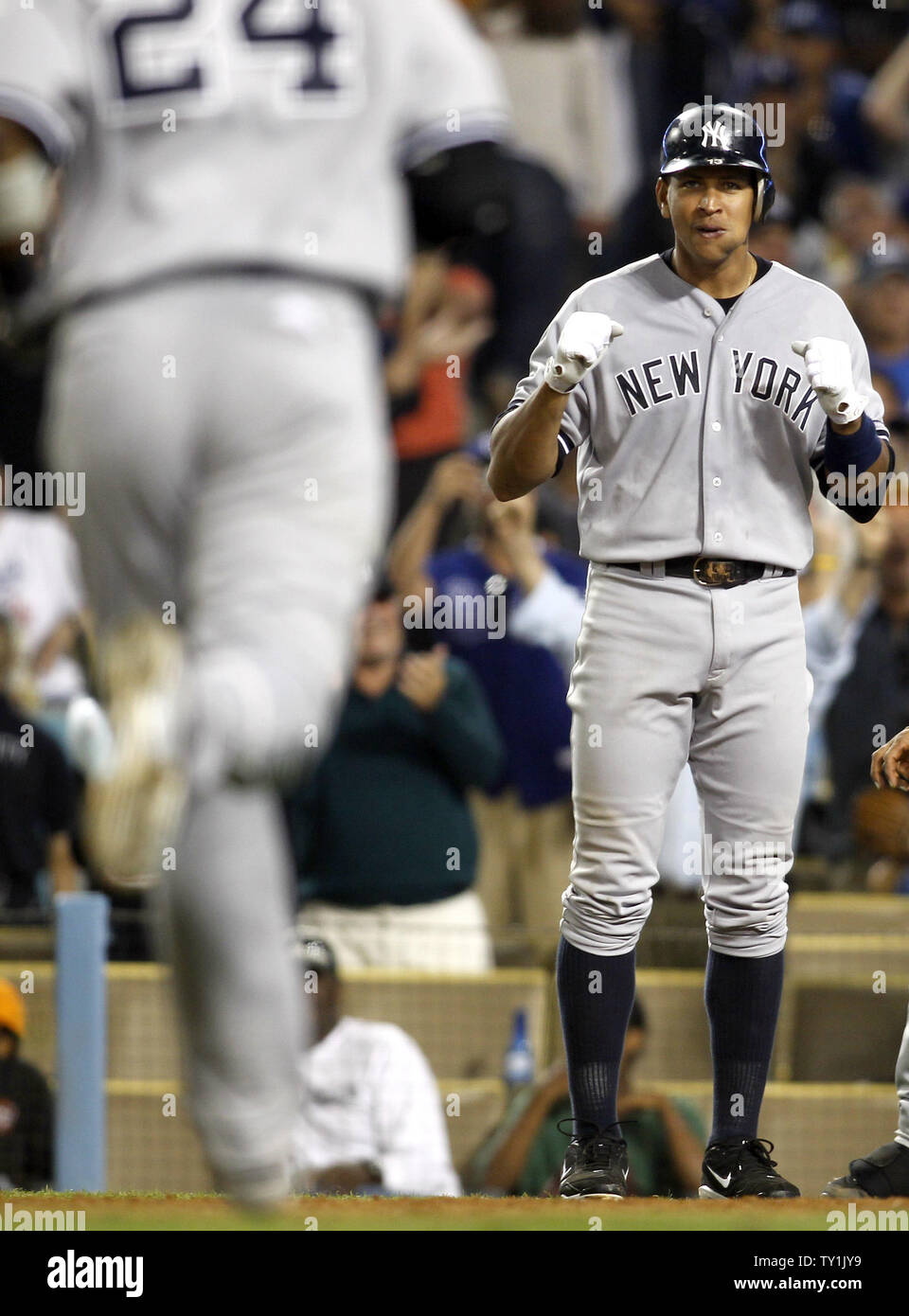 New York Yankees' Alex Rodriguez, right, waits for Robinson Cano after ...