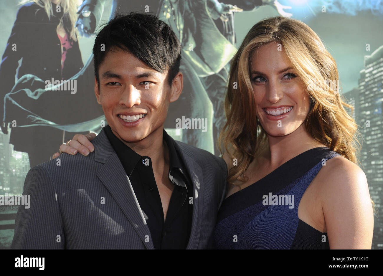 Cast member Gregory Woo (L) and Amanda Peters attend a benefit ...