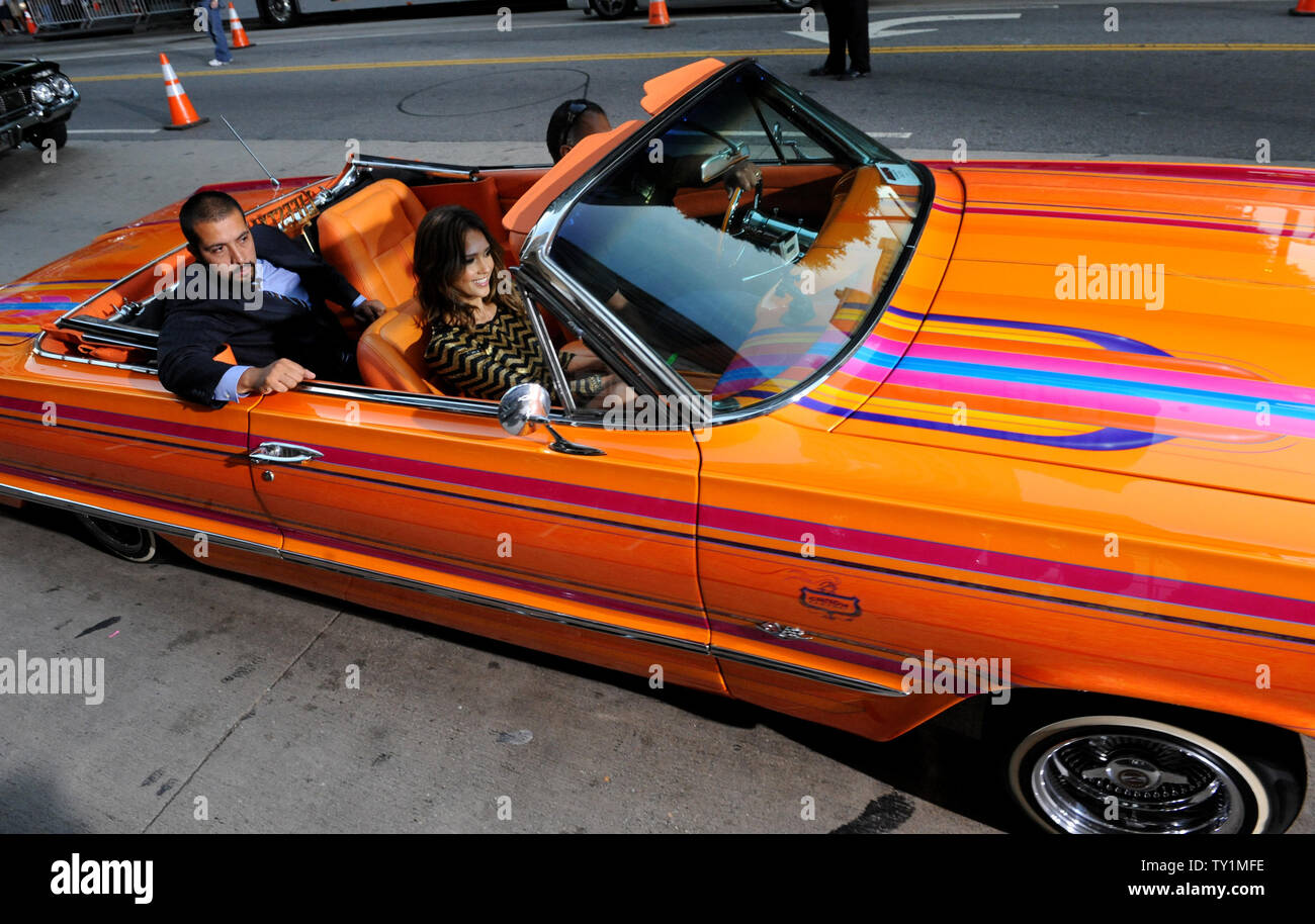 Cast member Jessica Alba arrives in a lowrider car at the premiere of ...