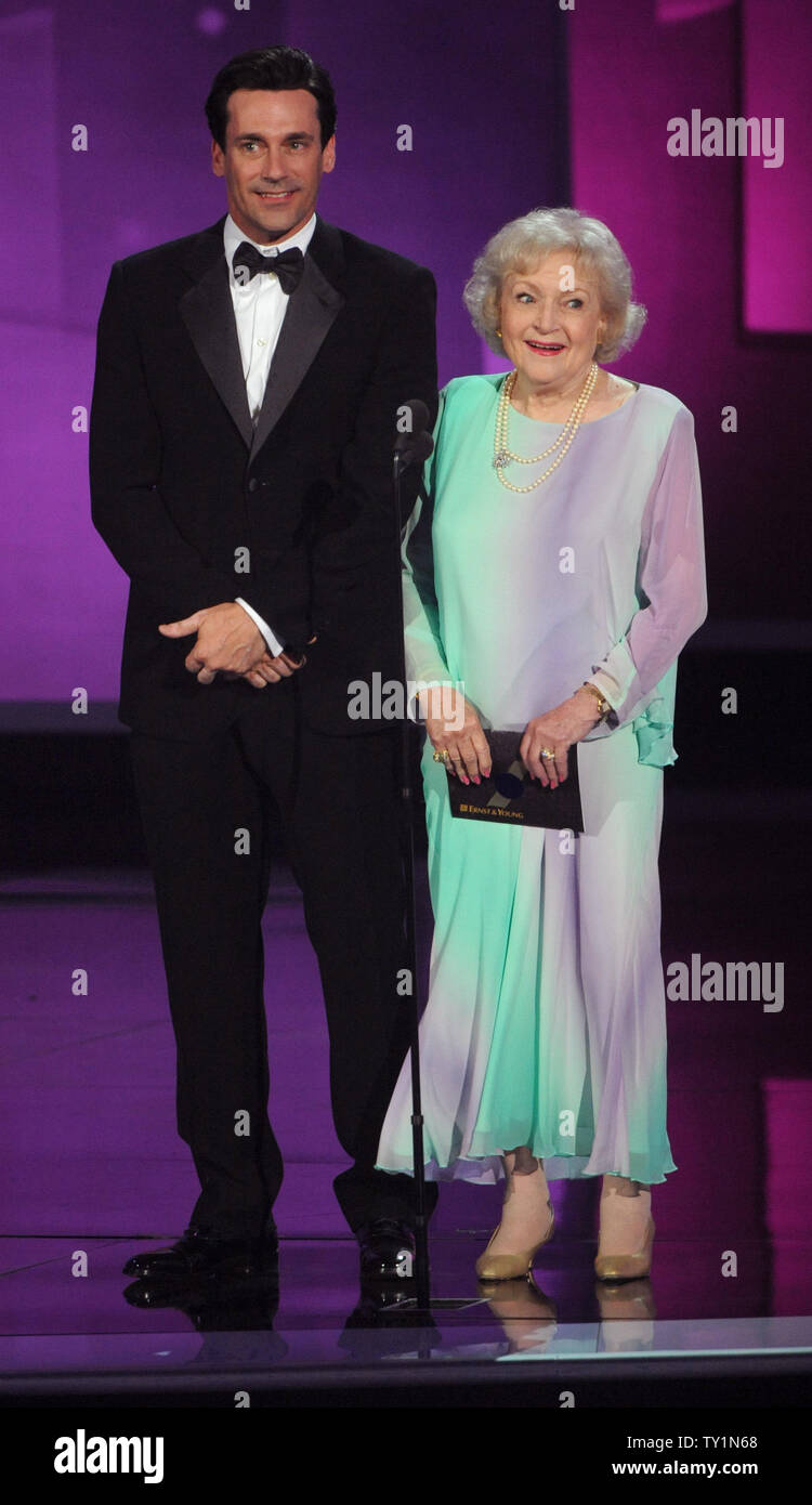 Actor Jon Hamm (L) and actress Betty White announce Eric Stonestreet as ...