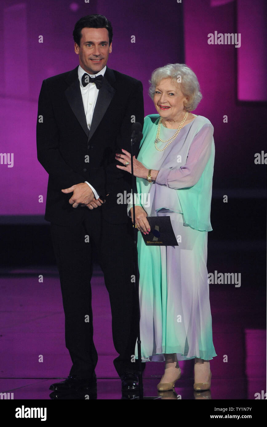 Actor Jon Hamm (L) and actress Betty White announce Eric Stonestreet as ...