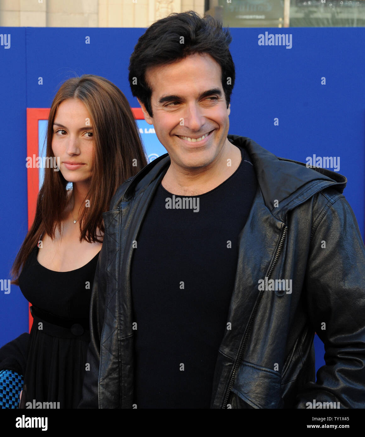 Magician David Copperfield and a guest attend the premiere of the ...