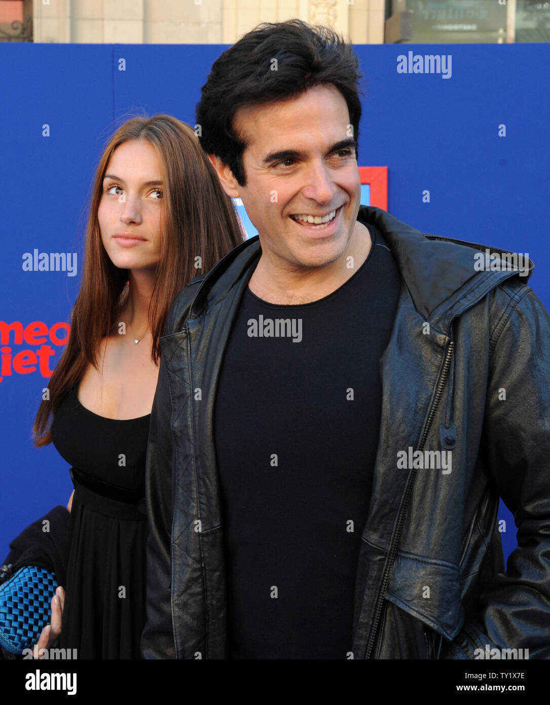 Magician David Copperfield and a guest attend the premiere of the ...
