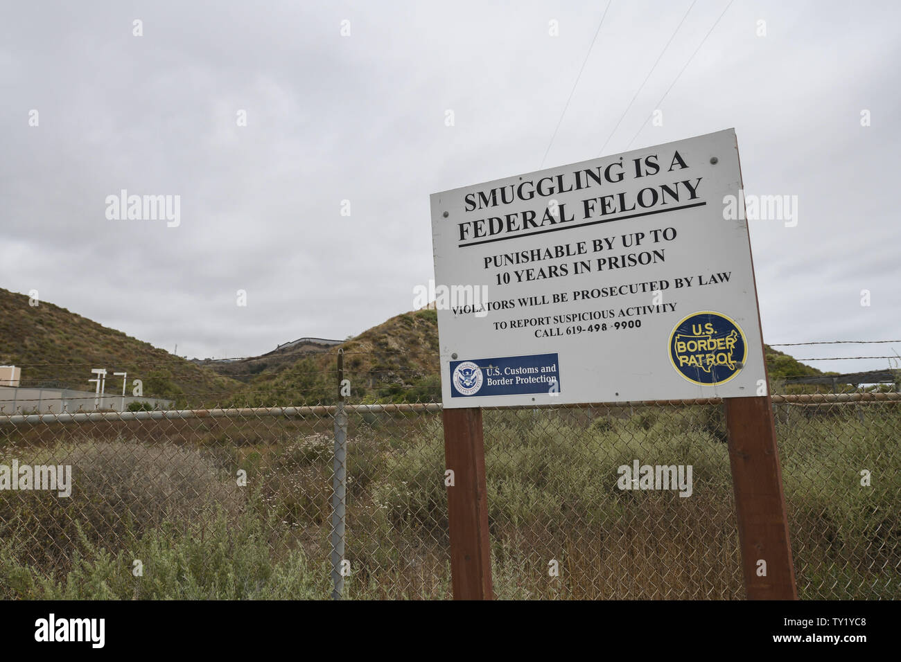 San Diego, CA, USA. 25th June, 2019. A sign warning against smuggling ...