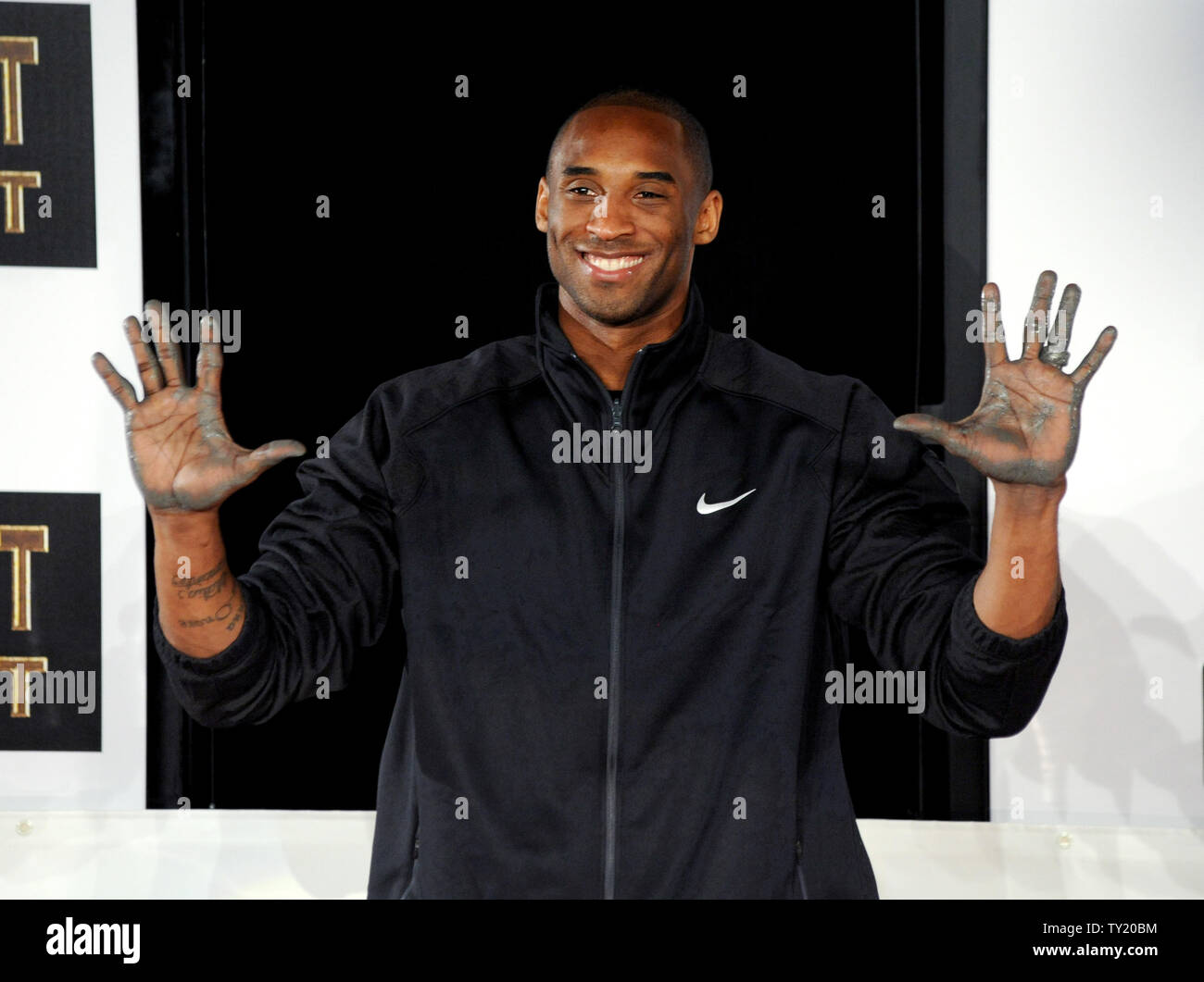 Los Angeles Lakers' Kobe Bryant holds up his hands after placing them ...