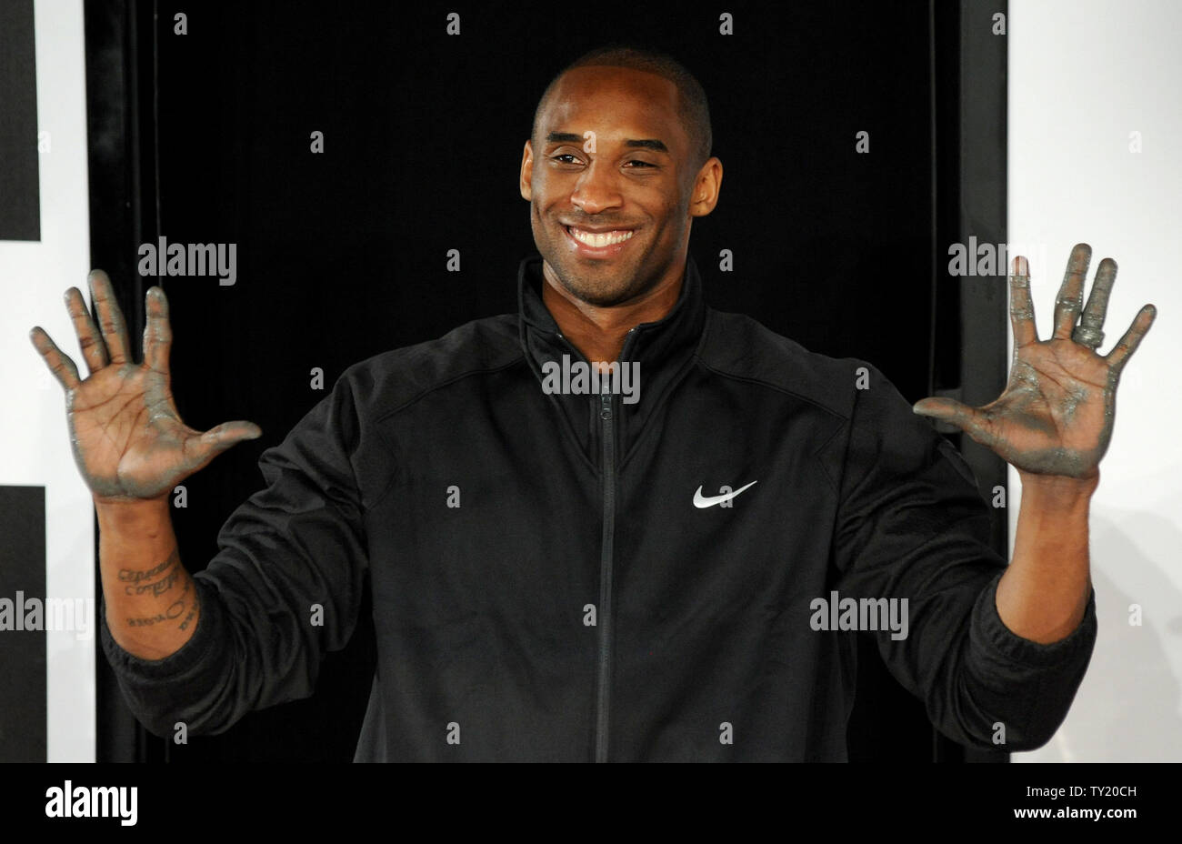 Los Angeles Lakers' Kobe Bryant holds up his hands after placing them ...