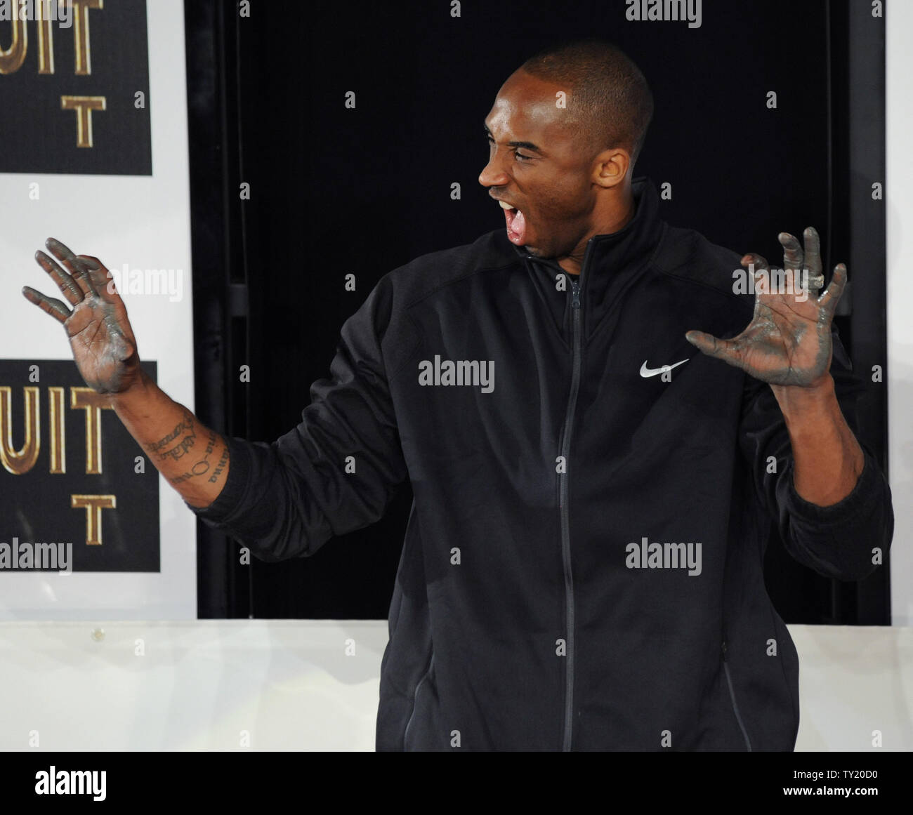 Los Angeles Lakers' Kobe Bryant holds up his hands after placing them ...