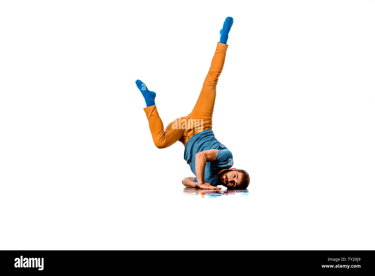 Happy young man dancing against plain white background Stock Photo - Alamy
