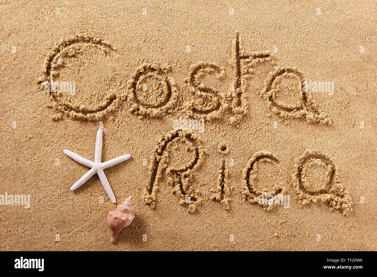 Costa Rica beach word sign written in sand Stock Photo - Alamy
