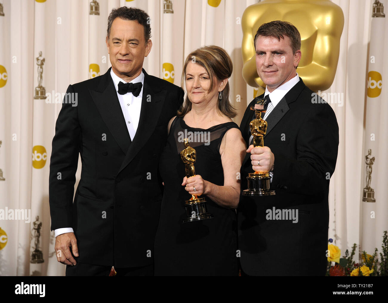 Presenter Tom Hanks poses with Achievement in Art Direction winners ...