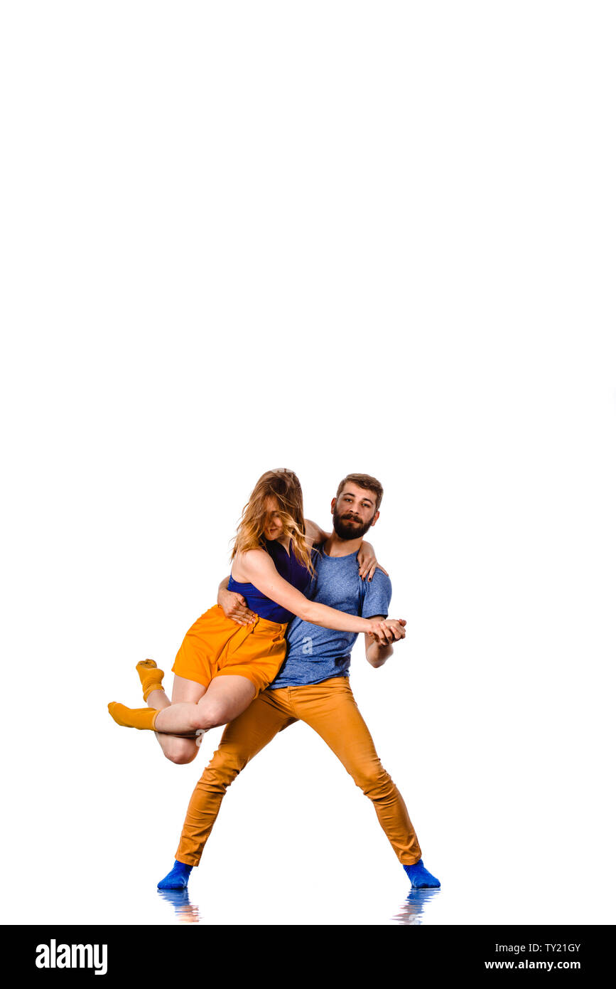 Attractive couple dancing hip-hop. Skillful modern style teenagers ...