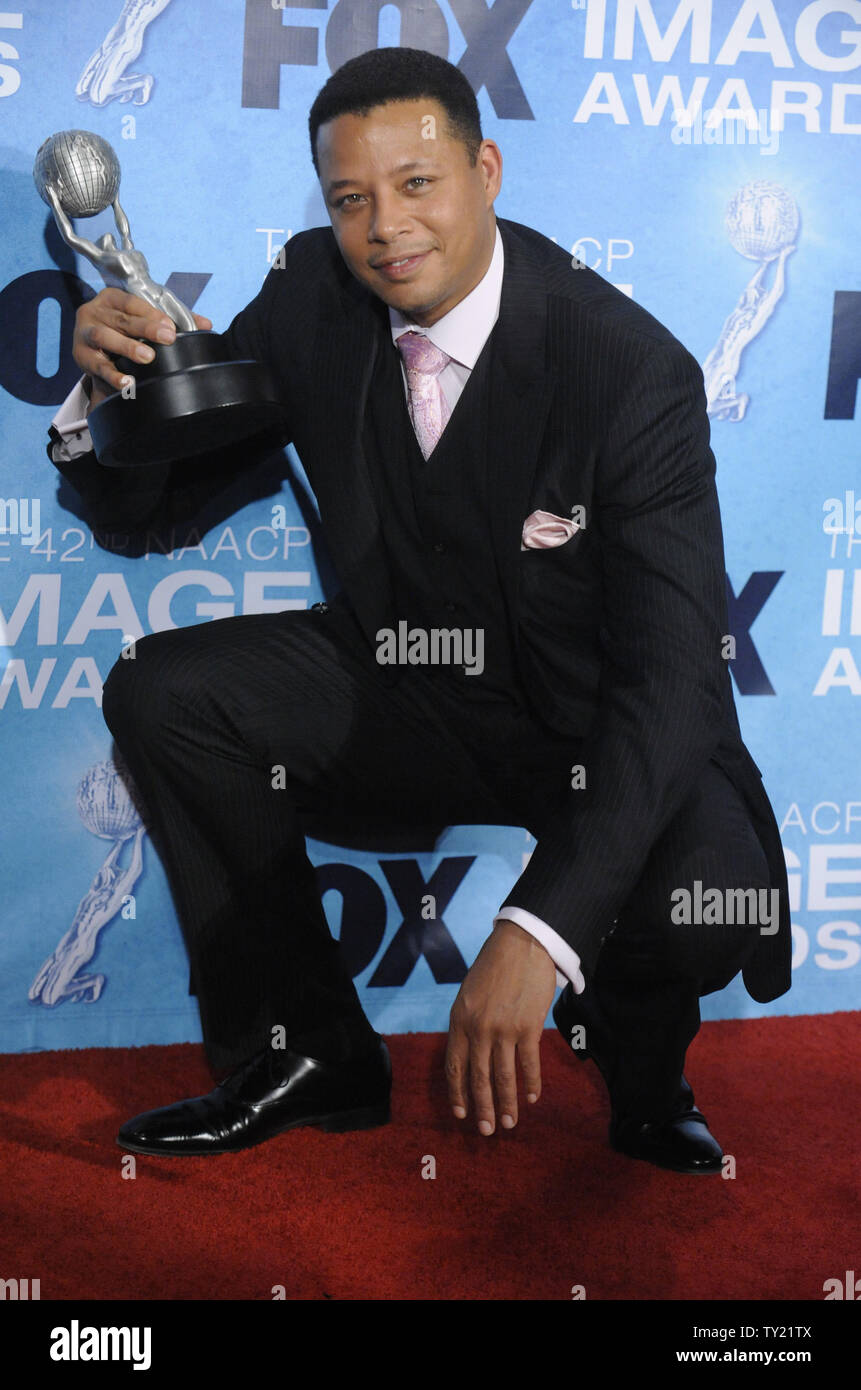 Terrence Howard poses backstage with his award at the 42nd NAACP Image ...
