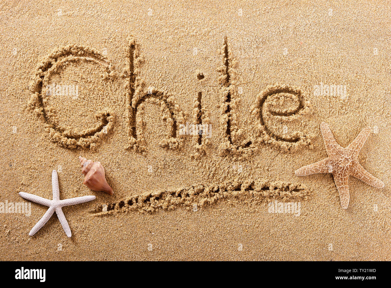 Chile beach word written in sand Stock Photo - Alamy