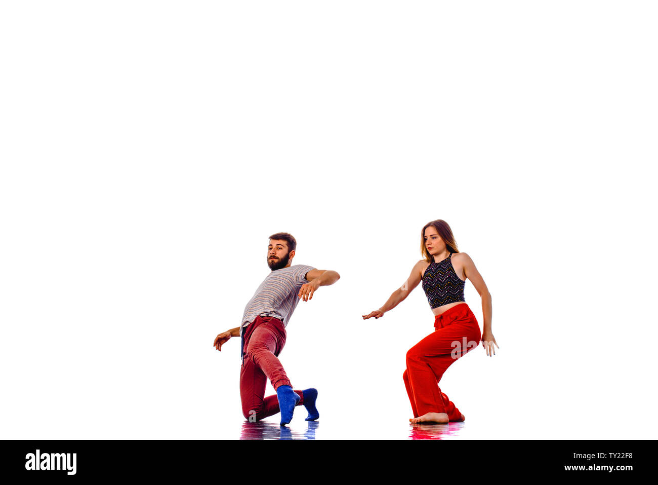 Dancers in action. Young couple of casual dancers performing modern ...
