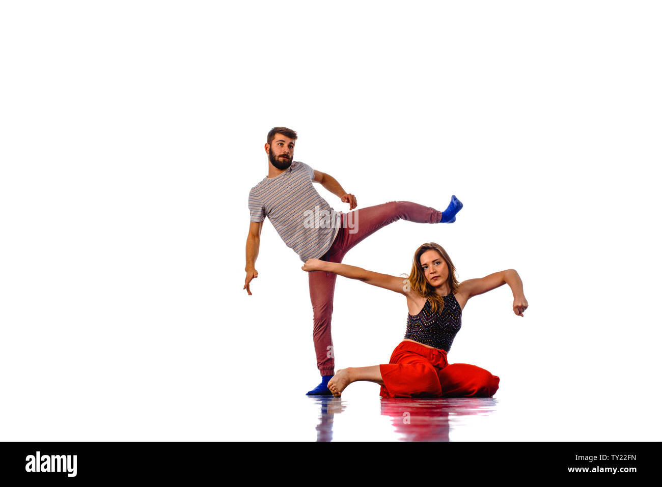 Romantic couple dancing together in studio, isolated on white ...
