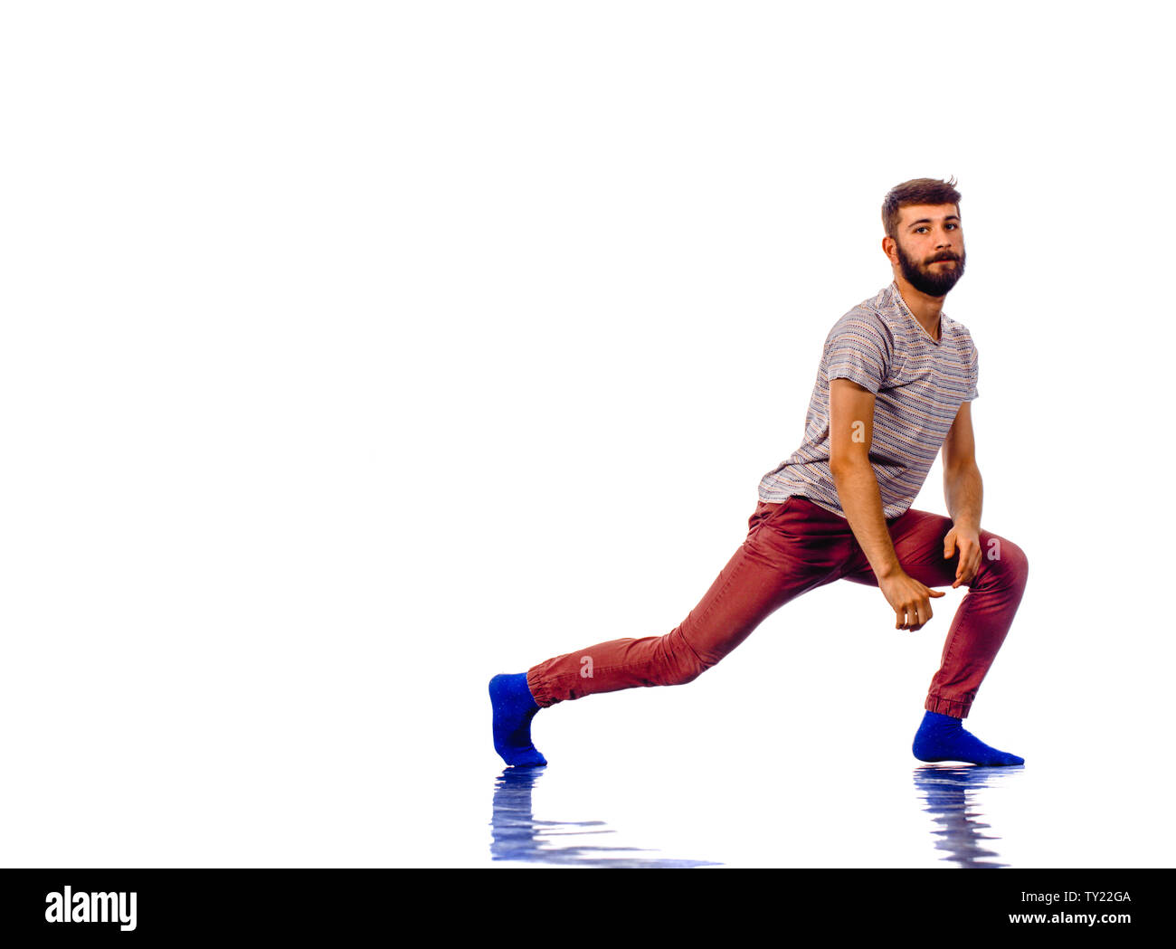 Portrait of a young man dancing of joy. Isolated image on white ...