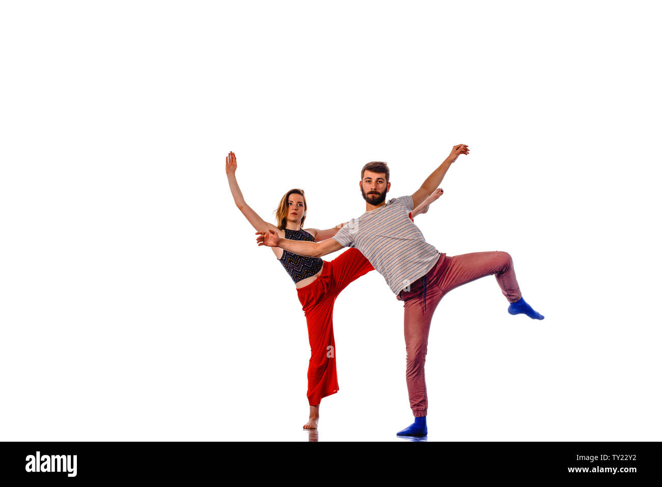 Romantic couple dancing and smiling in studio Stock Photo - Alamy