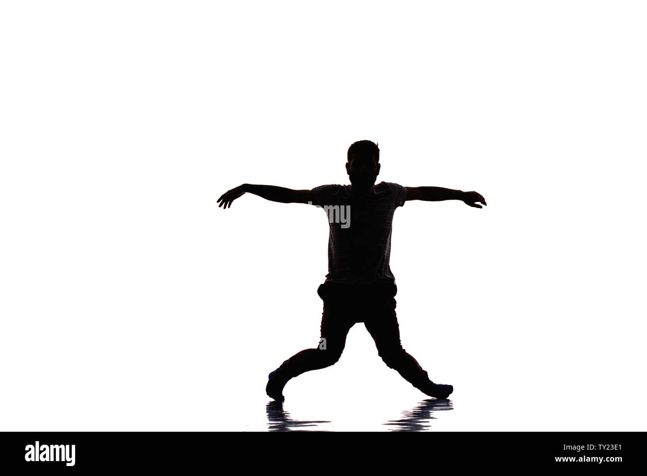 Silhouette male dancer practicing modern dance isolated on white ...