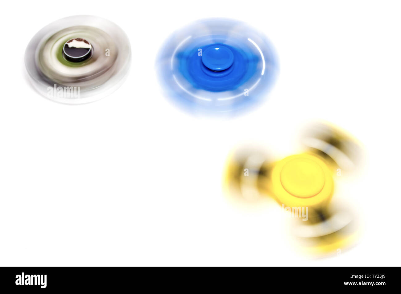 fidget hand spinner spinning on white background Stock Photo - Alamy