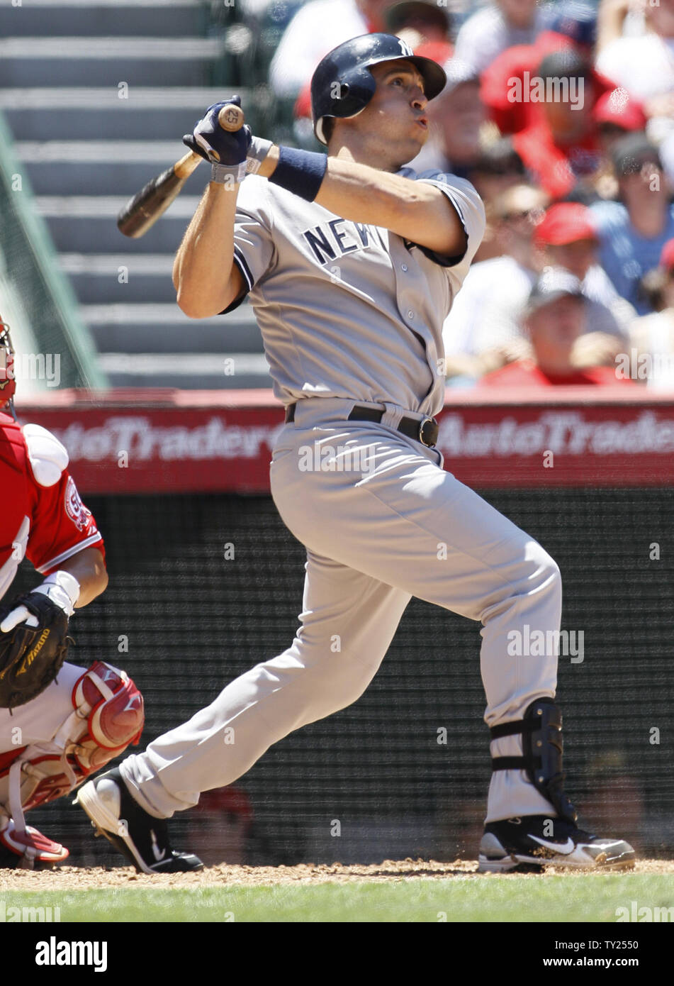 New York Yankees' Mark Teixeira hits a home run against the Los Angeles Angels in the fifth ...