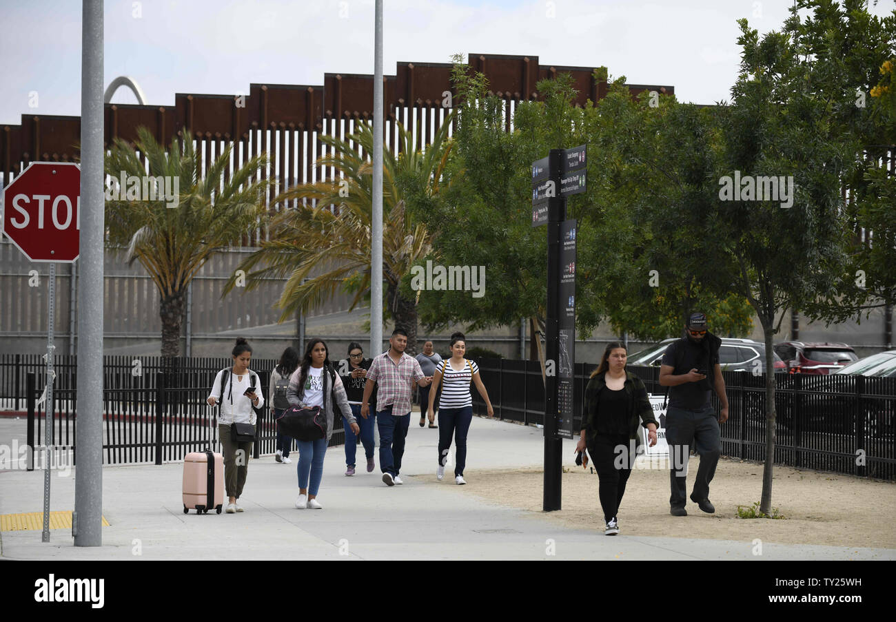 San Diego, CA, USA. 25th June, 2019. Pedestrians walk past a section of ...