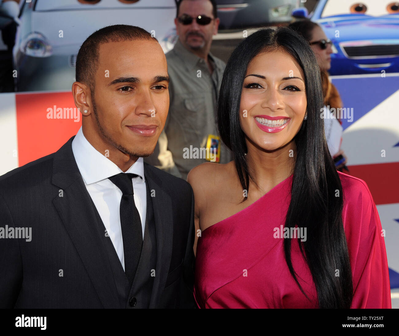 Formula 1 race car driver/actor Lewis Hamilton (L) and actress ...