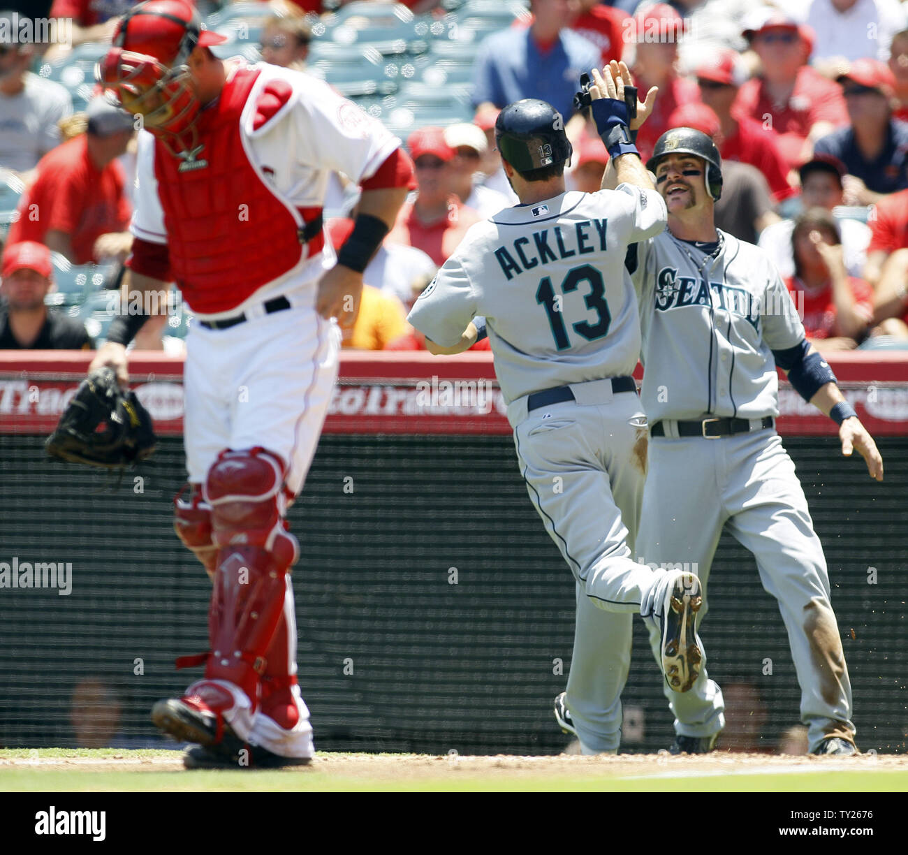 Seattle Mariners' Dustin Ackley (13) and Brendan Ryan, right ...