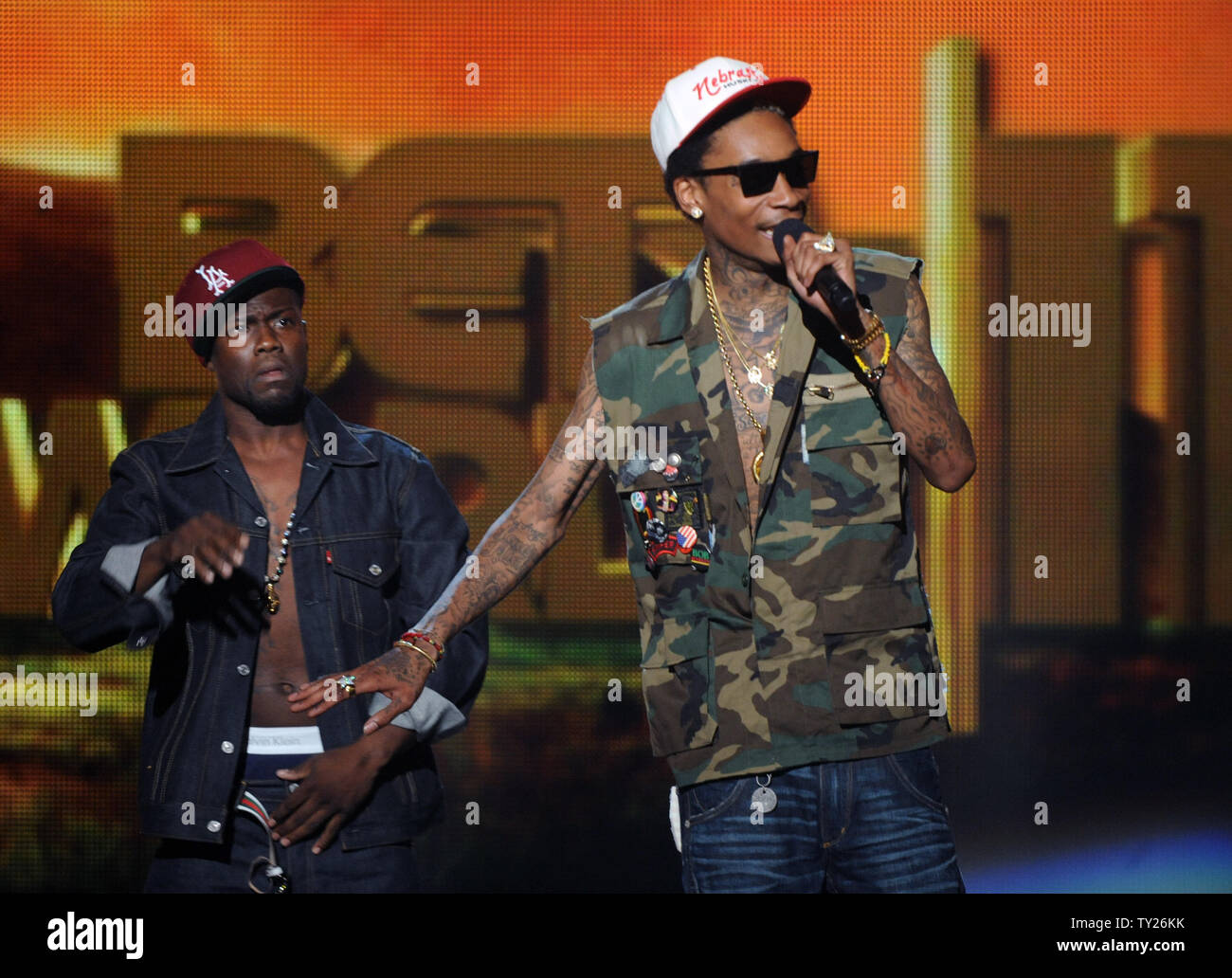 Kevin Hart (L) and Wiz Khalifa ham it up onstage onstage during the BET ...