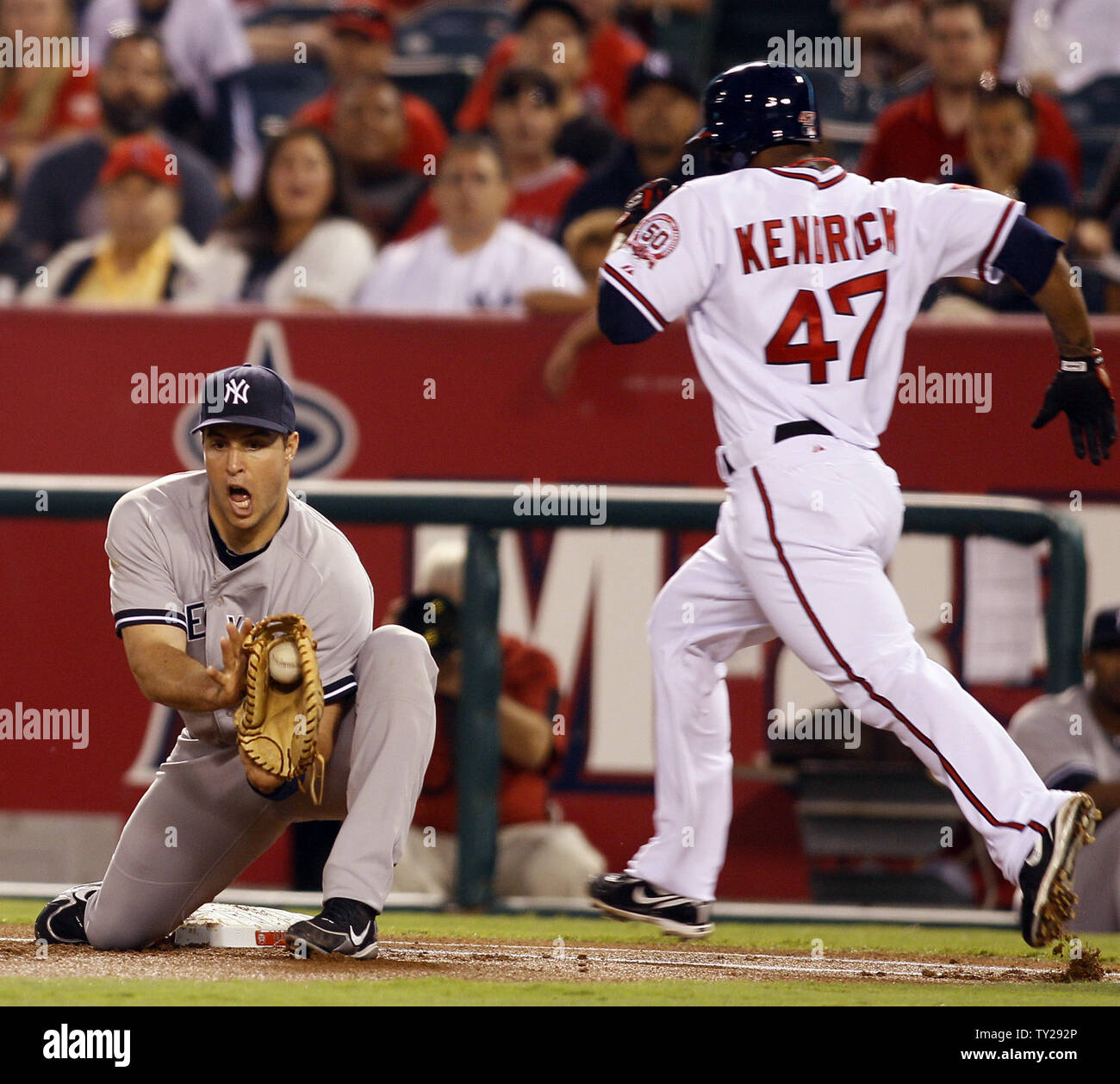 New York Yankees first baseman Mark Teixeira (25) catches the ball for ...