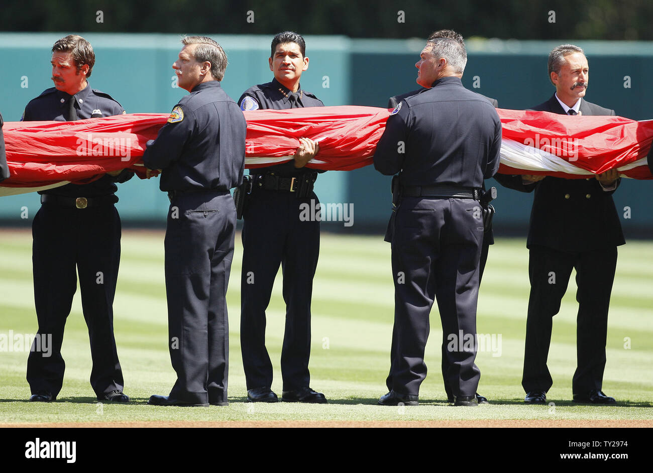 Police firemen hold american hi-res stock photography and images - Alamy