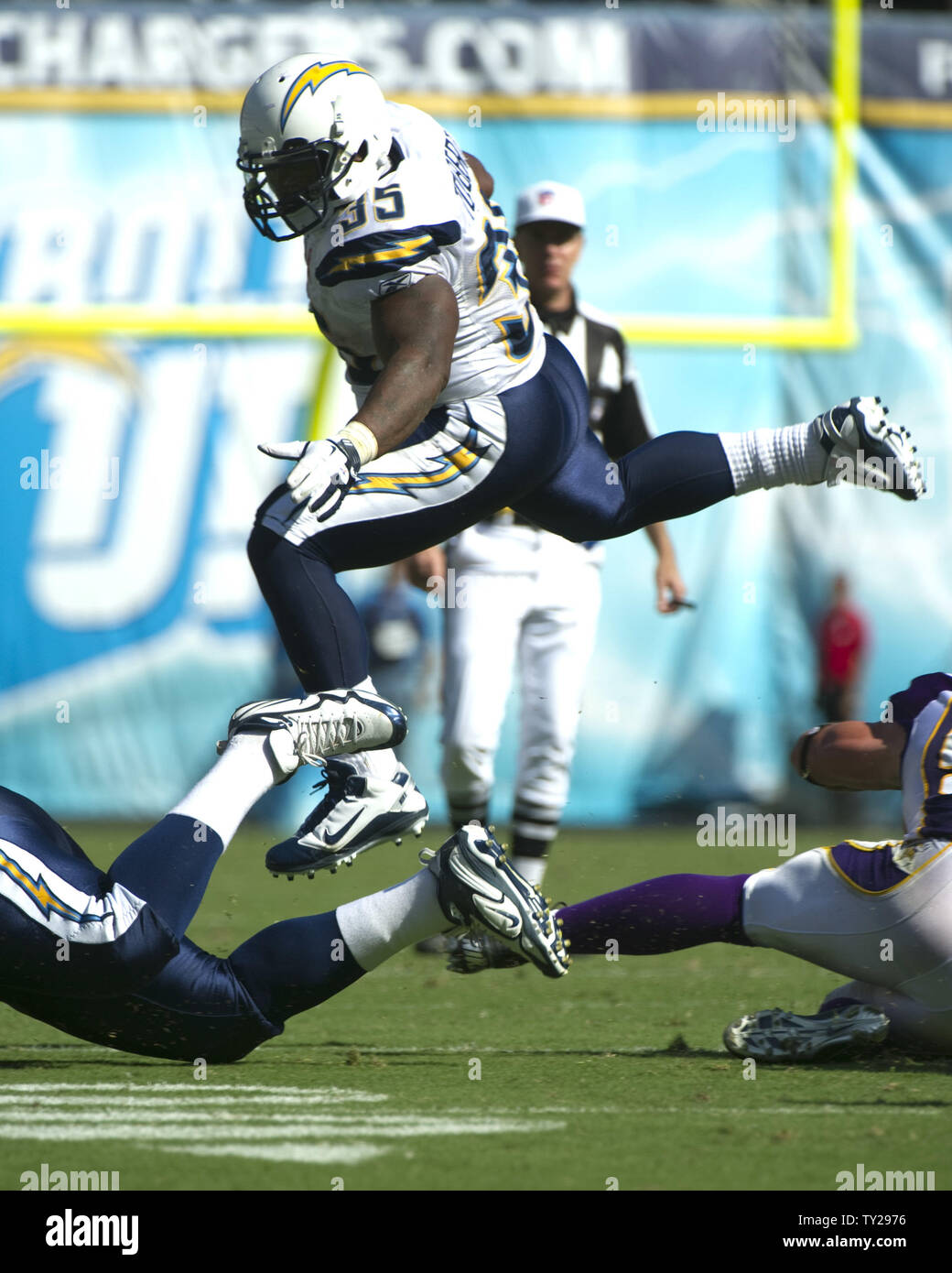 San Diego Chargers' runningback Mike Tolbert leaps through the line ...
