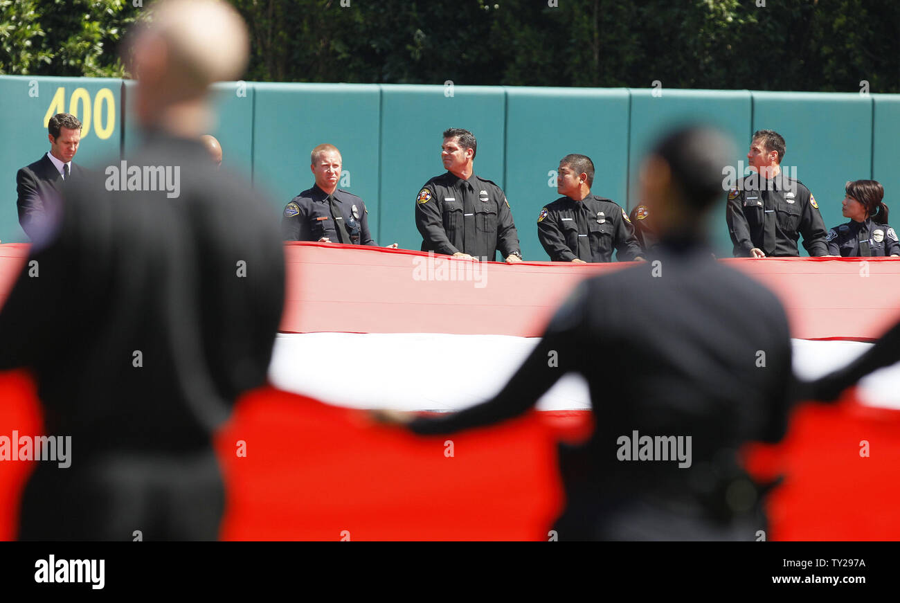 Police firemen hold american hi-res stock photography and images - Alamy