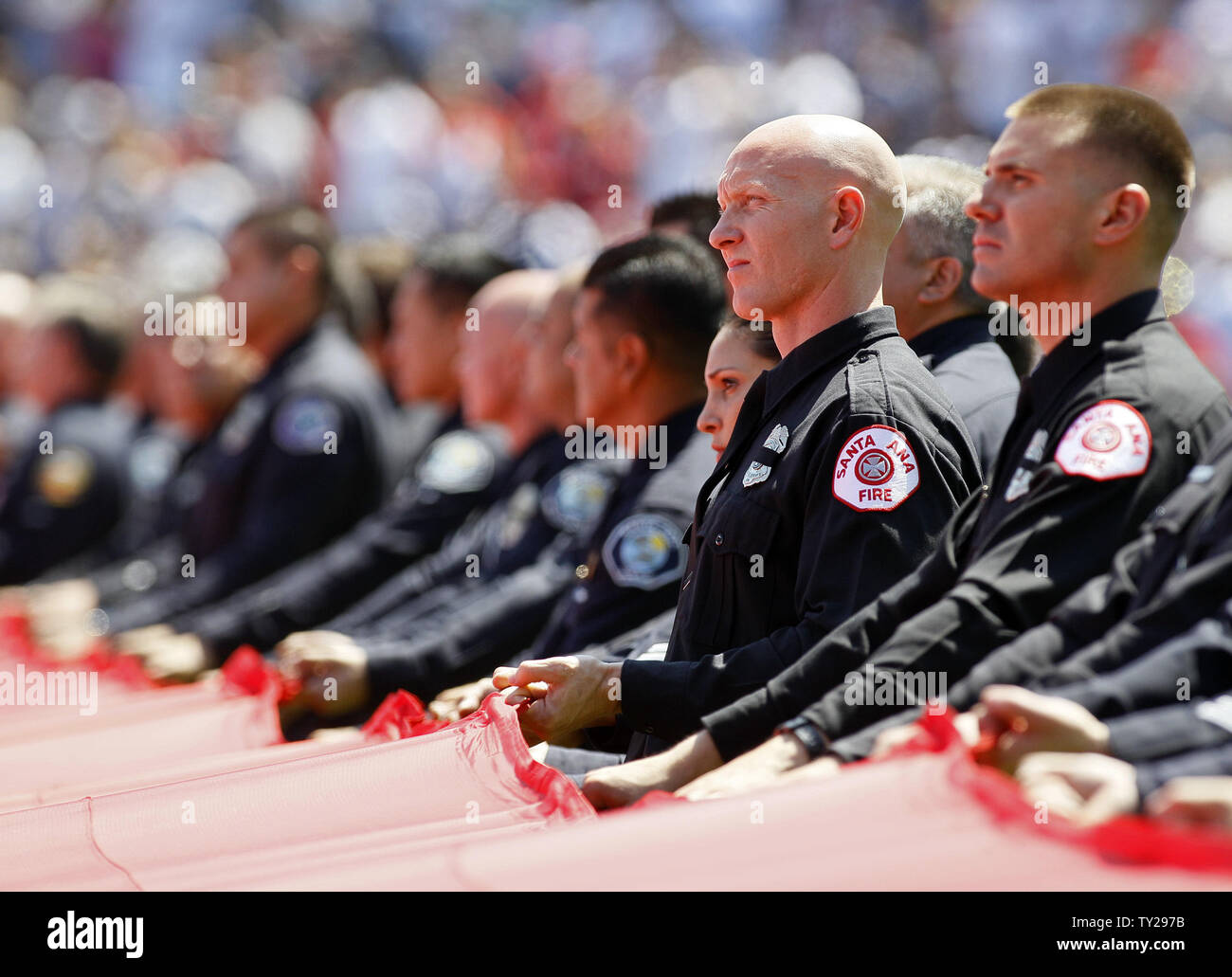 Police firemen hold american hi-res stock photography and images - Alamy