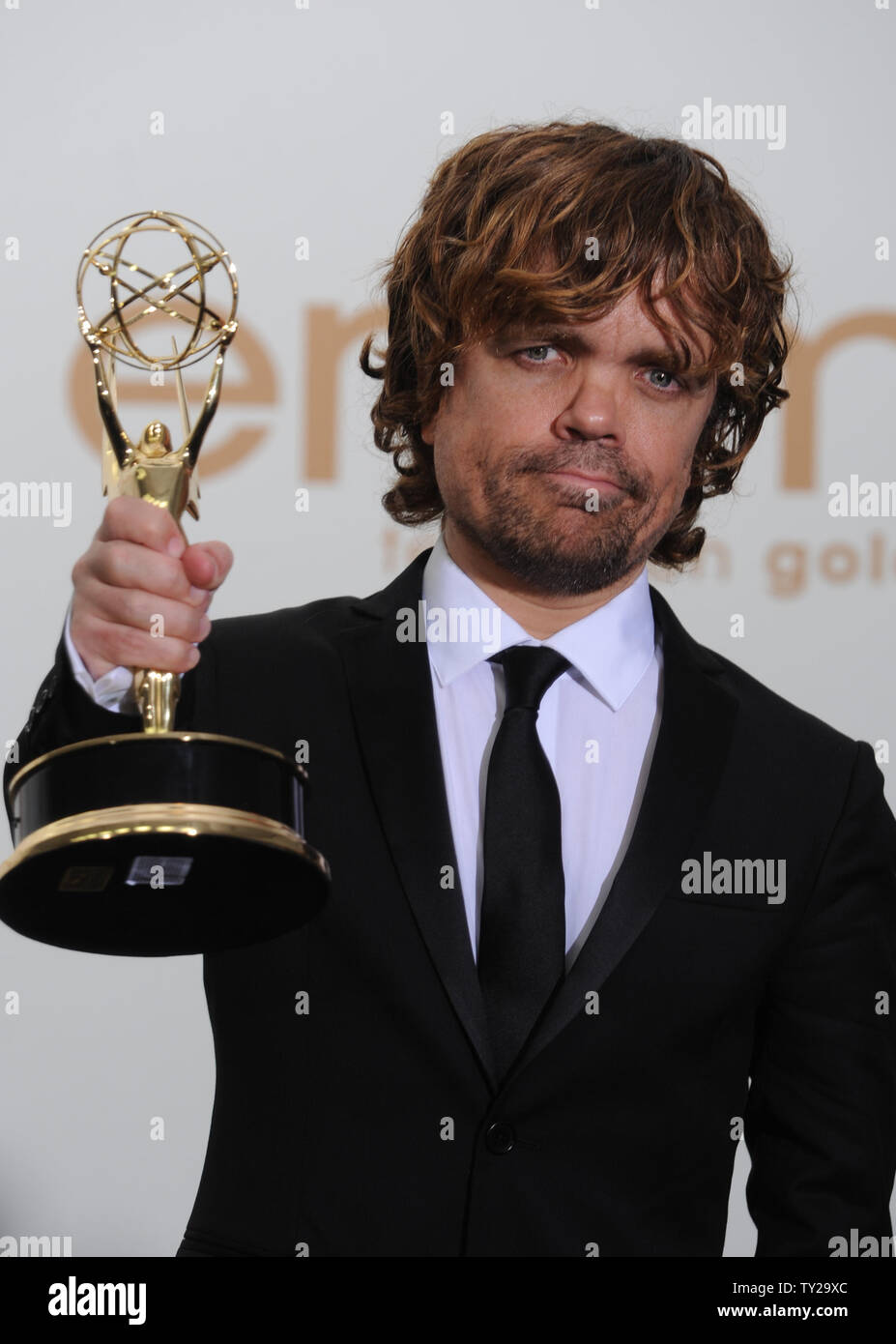 Peter Dinklage holds his award for Best Supporting Actor in a Drama ...
