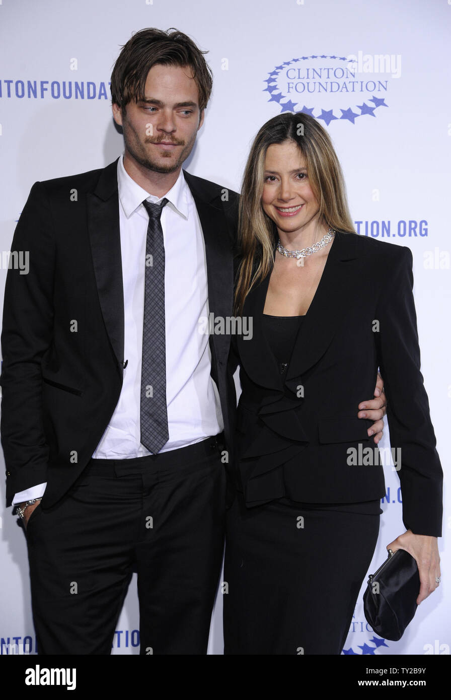 Actress Mira Sorvino (R) and husband Christopher Backus attend the ...