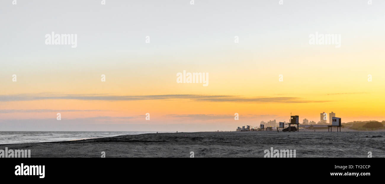 Coastline resort city during the sunset golden hour and the sea and ...