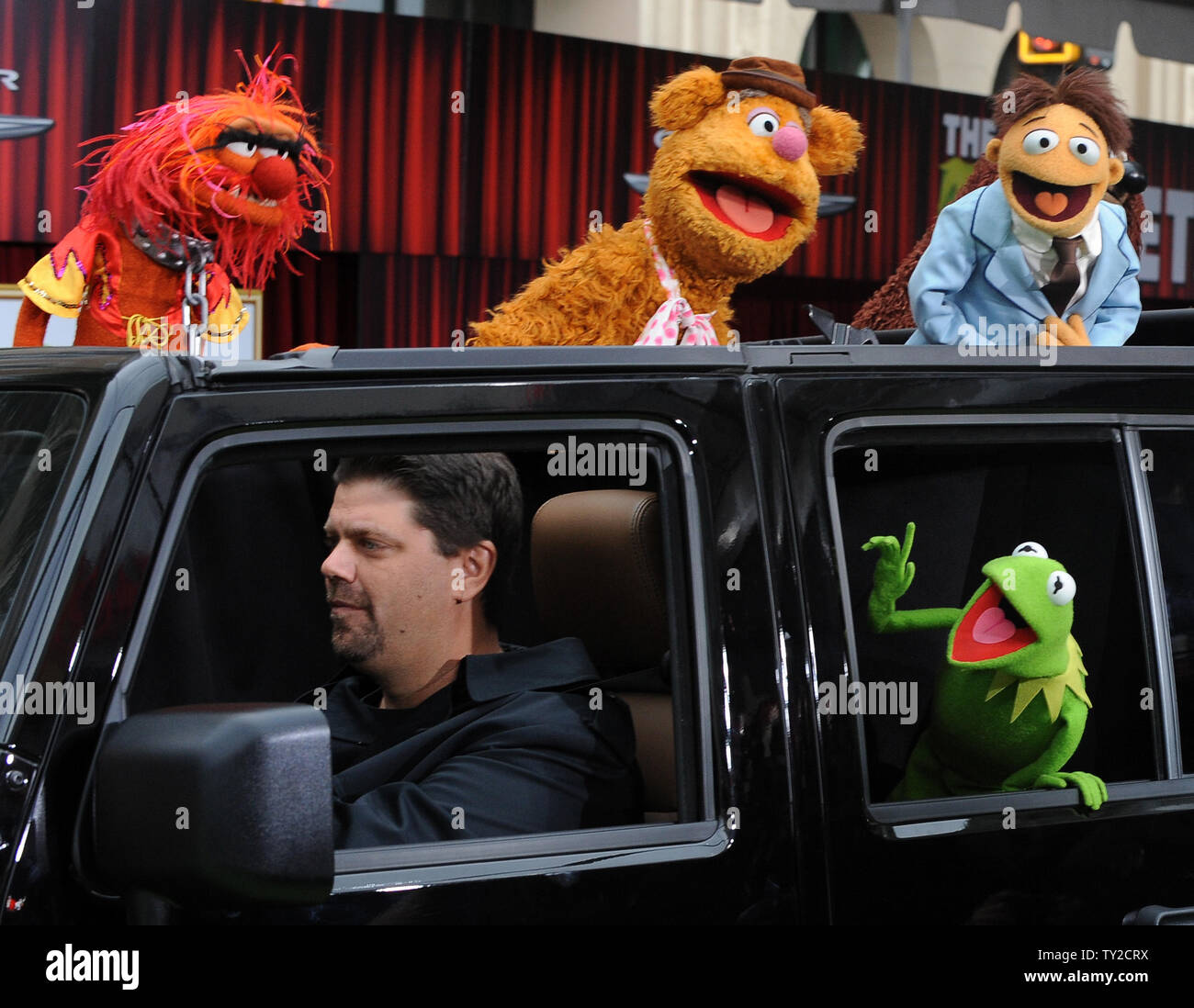 Animal, Fozzie Bear. Ernie and Elmo attend the motion picture musical ...