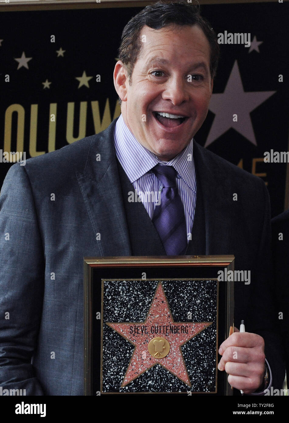 Actor Steve Guttenberg holds a replica plaque during an unveiling ...