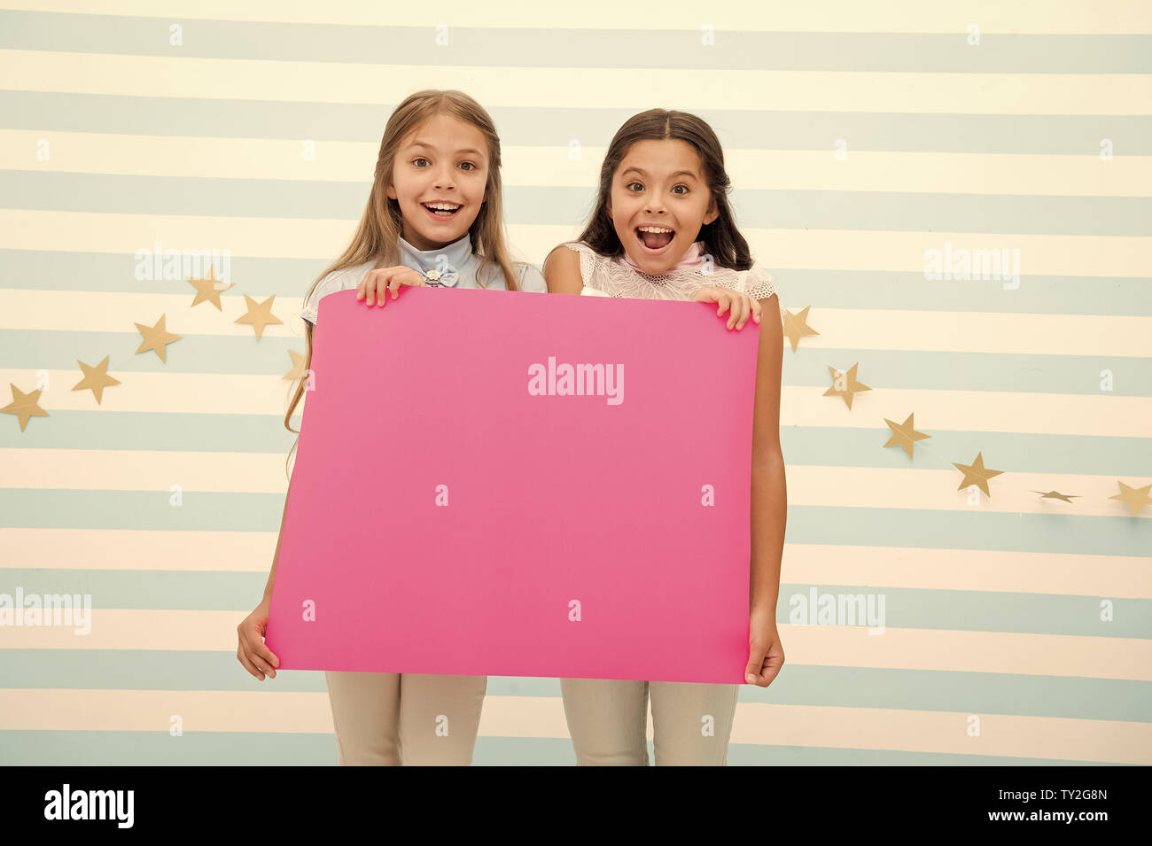 Amazing surprising news. Girl hold announcement banner. Girls kids ...