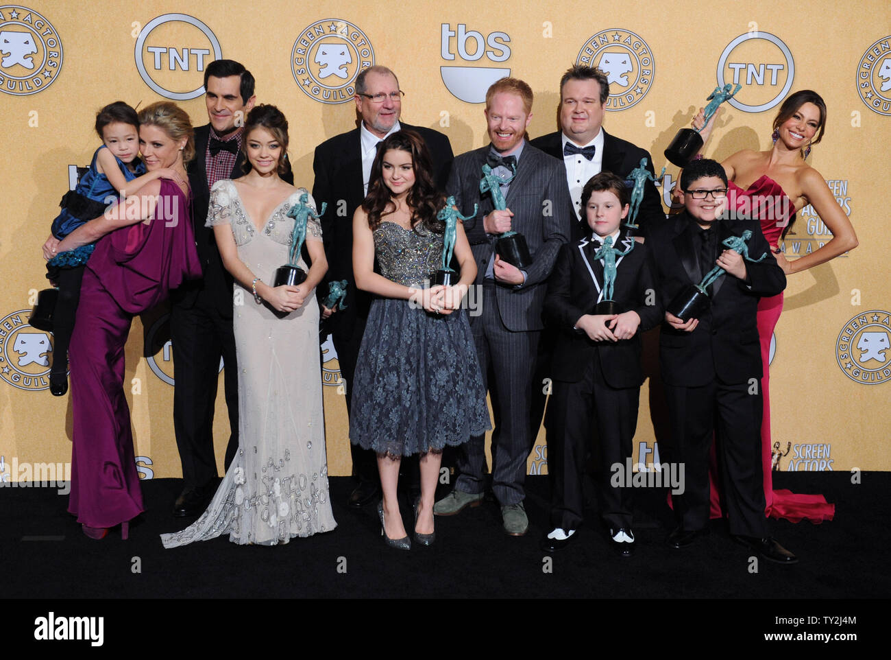 "Modern Family" cast members appear backstage with the award they ...