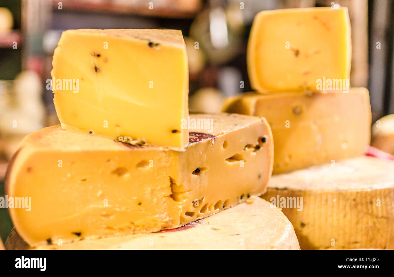 Selection of traditional Italian cheeses on a display, selective focus ...