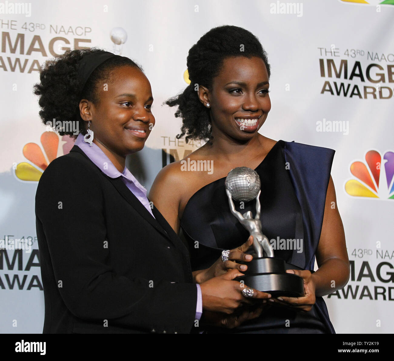Writer/director Dee Rees (L) and actress Adepero Oduye hold their award ...